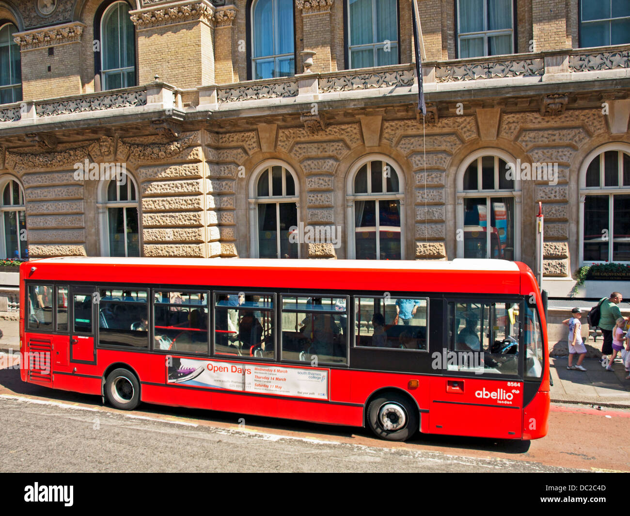 Red London bus near Victoria Stock Photo - Alamy