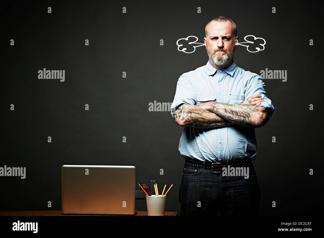Man with arms crossed fuming in silence Stock Photo - Alamy