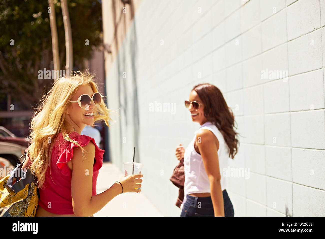 Women walking away Stock Photo - Alamy