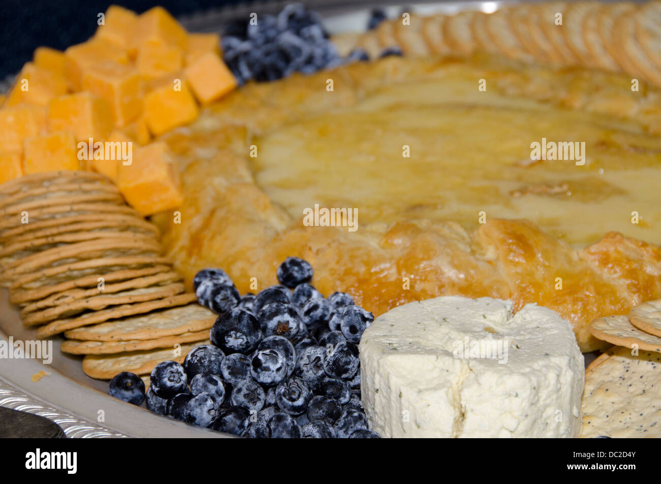 Belize. Tray of appetizers including blueberries, baked brie, cheddar ...