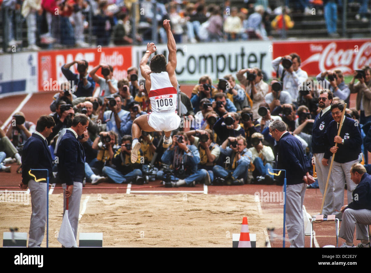 Male long jumper in action Stock Photo - Alamy