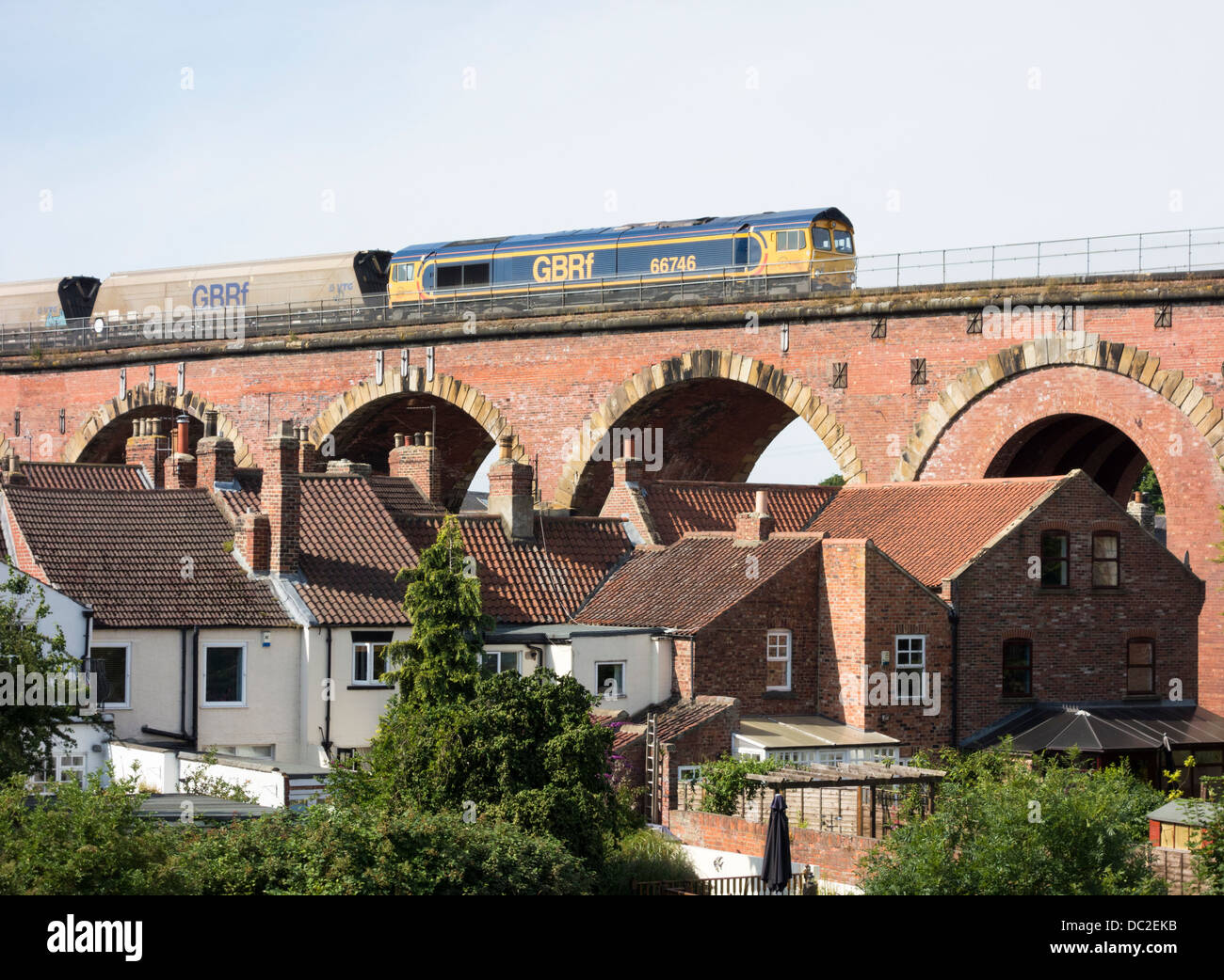 Coal freight train crossing viaduct over the river Tees at Yarm near ...