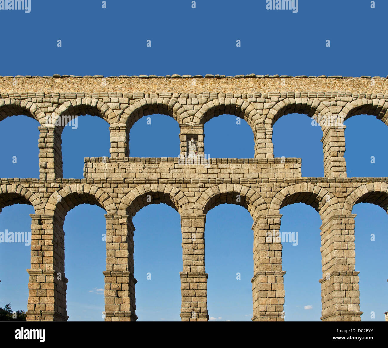 The central part of the roman aqueduct, with the niche and the statue ...