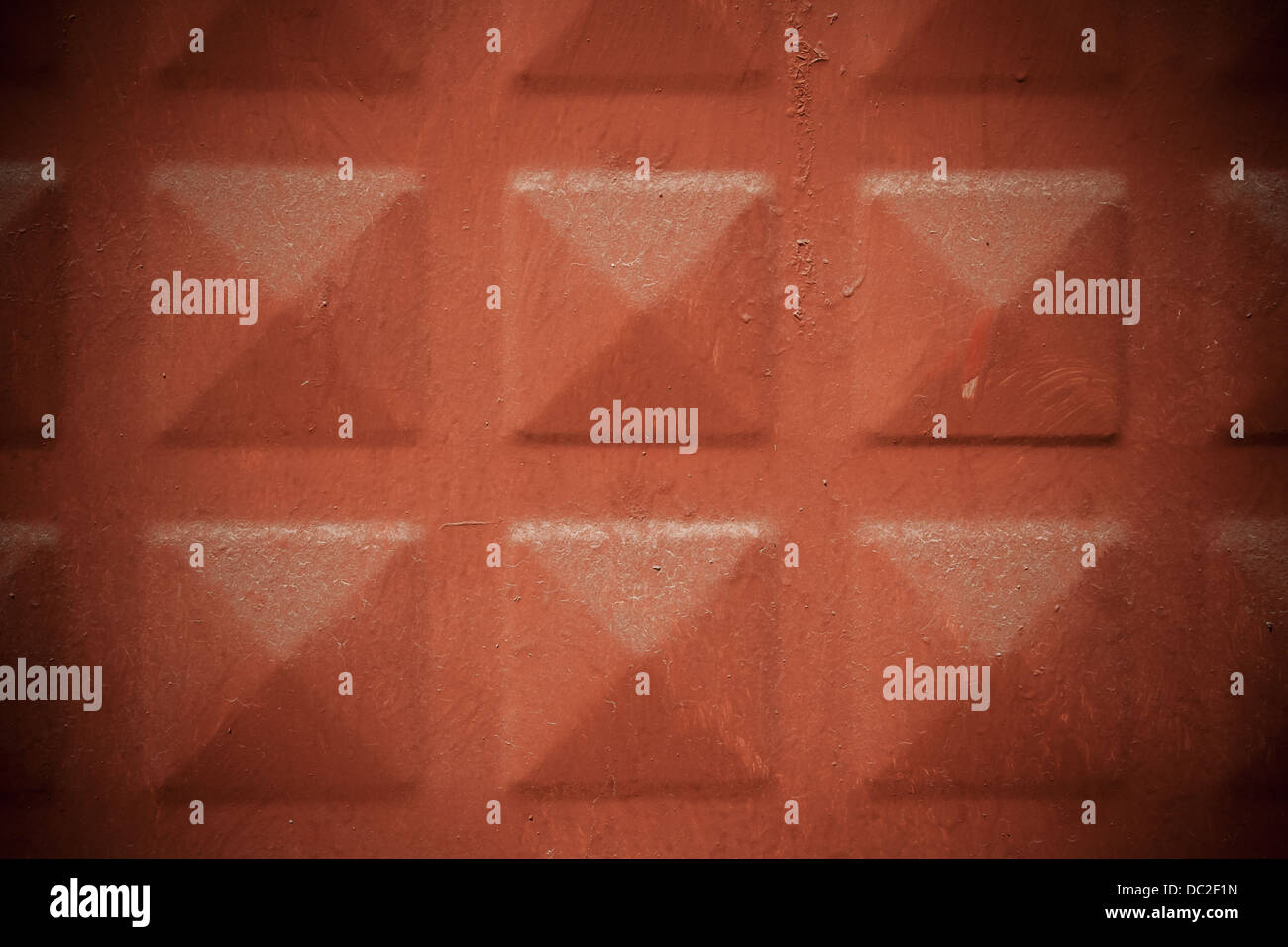 Terra Cotta Colored Iron Door background tiled with square pattern ...