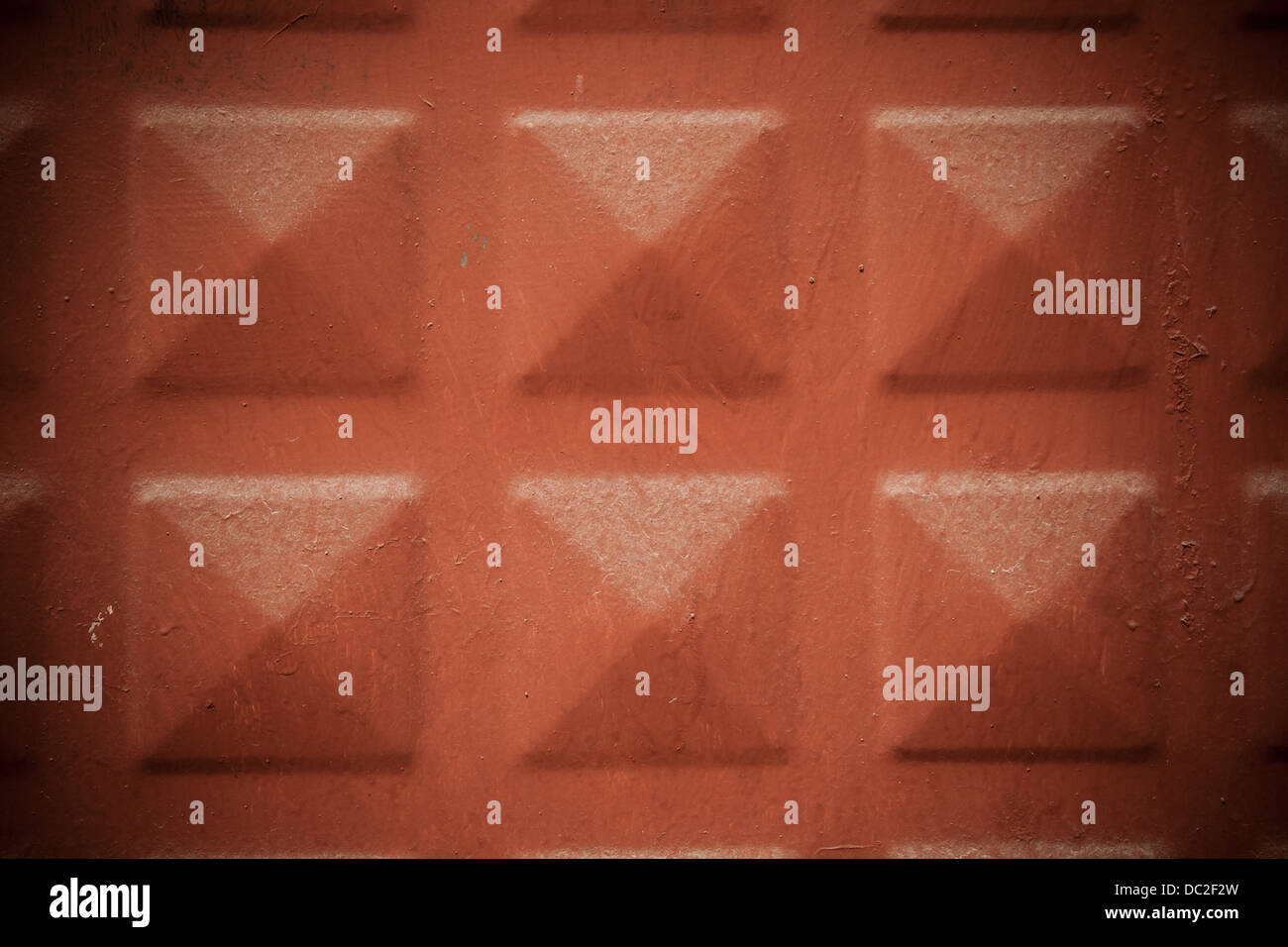 Terra Cotta Colored Iron Door background tiled with square pattern ...