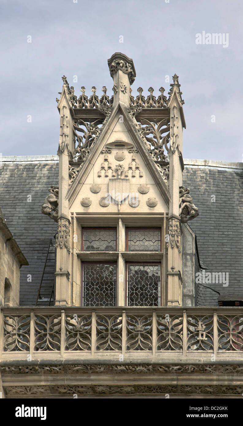 This image features the mullion window and coat of arms (CoA) of ...