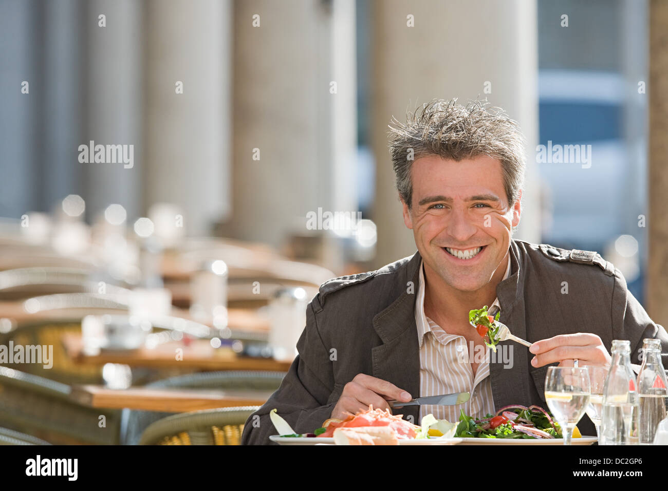 A portrait of a man eating alfresco Stock Photo - Alamy