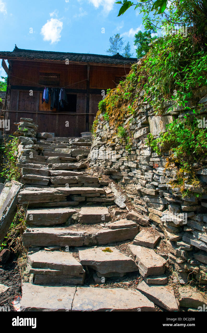Miao building on a long steep slope Stock Photo - Alamy