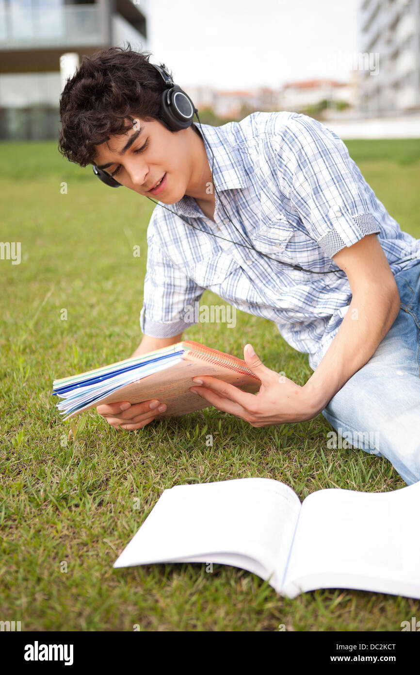 Young boy studying at the park Stock Photo - Alamy