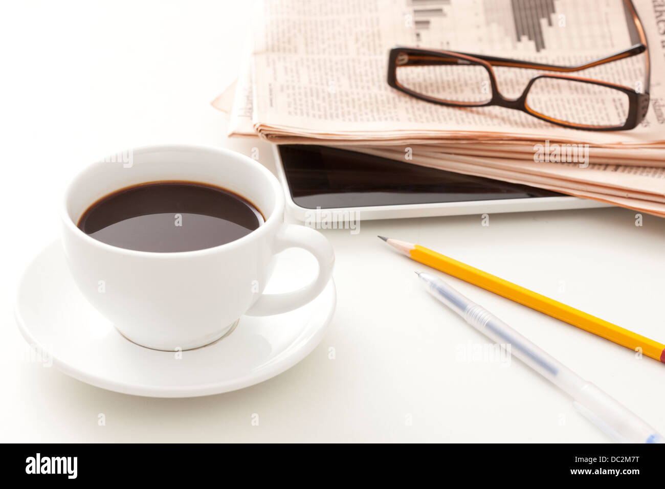 Office items and coffee on desk Stock Photo - Alamy