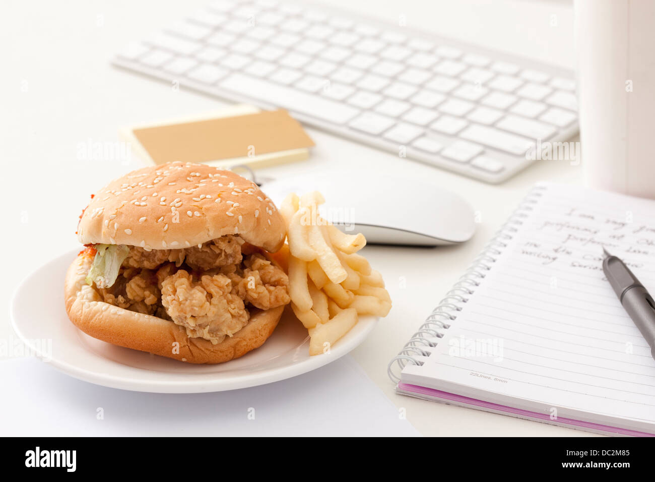 Unhealthy eating at desk hi-res stock photography and images - Alamy