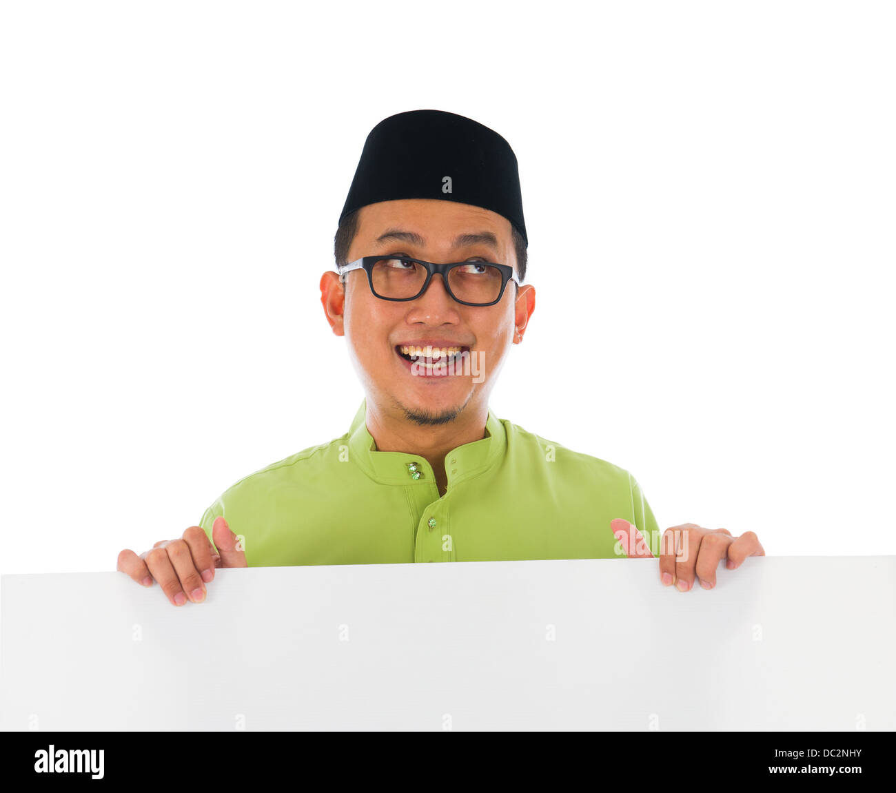 malay male with blank card during hari raya Eid al-Fitr celebration ...