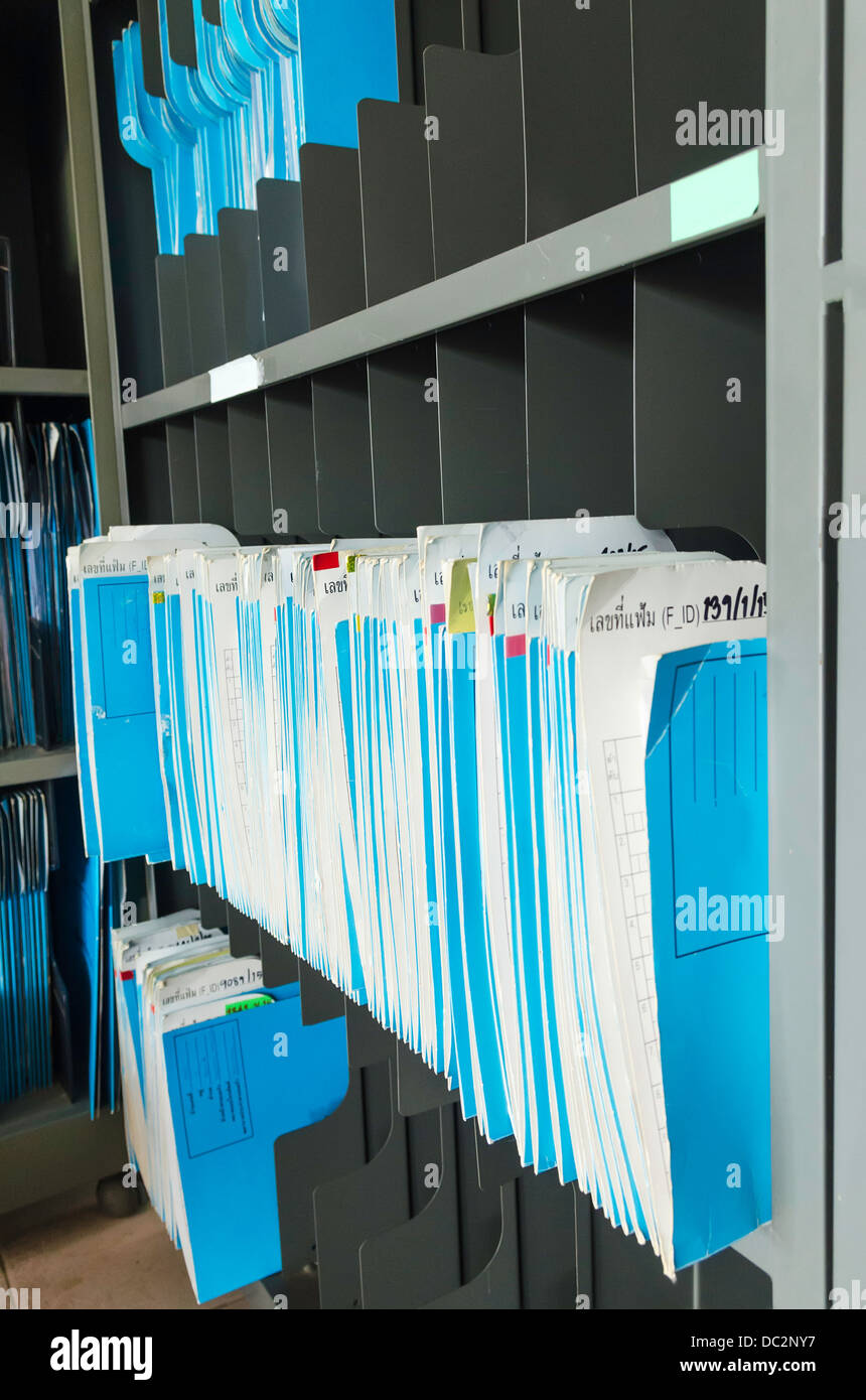 Shelf full of folders and files in an office Stock Photo - Alamy