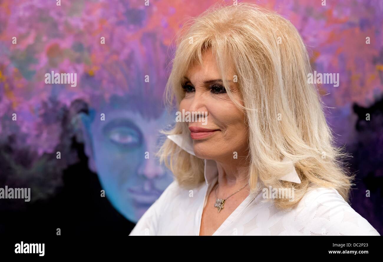 Hamburg, Germany. 07th Aug, 2013. Singer and painter Amanda Lear poses ...