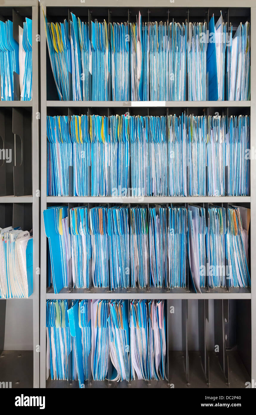 Shelf full of folders and files in an office Stock Photo - Alamy