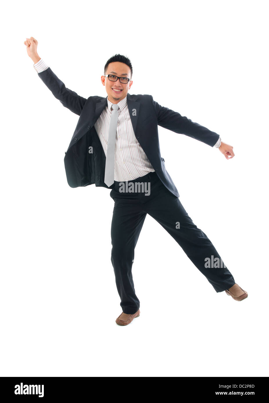cheerful businessman dancing in success over a white background Stock ...
