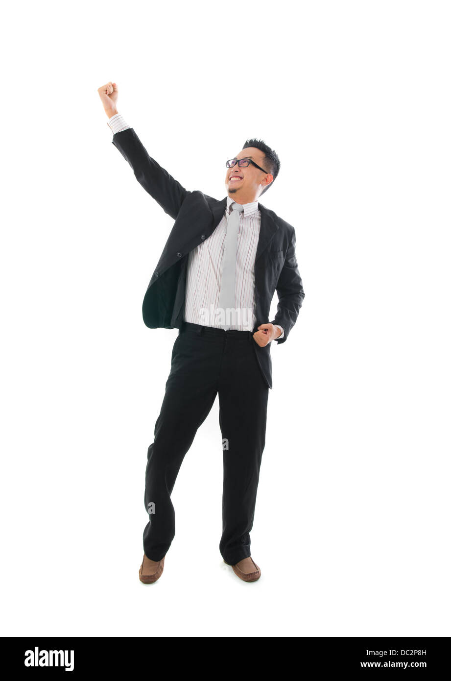 cheerful businessman dancing in success over a white background Stock ...