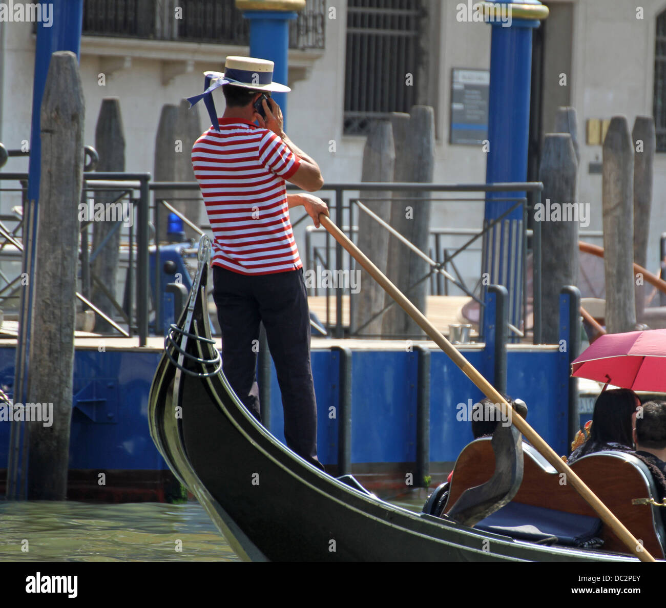 skilled Venetian gondolier pilot his gondola while talking to your ...