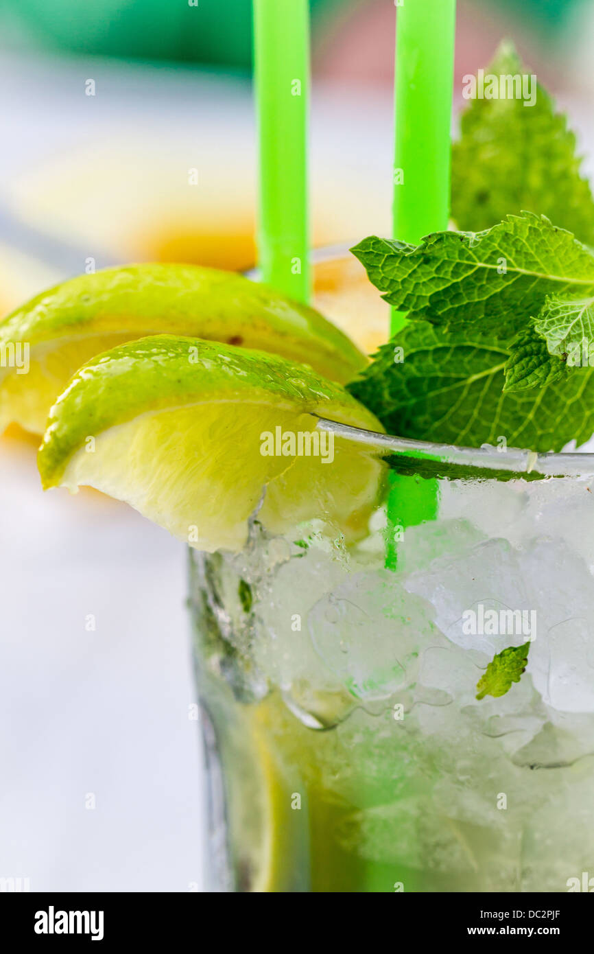 Lemon drink with lemnon, mint and ice in glass Stock Photo - Alamy