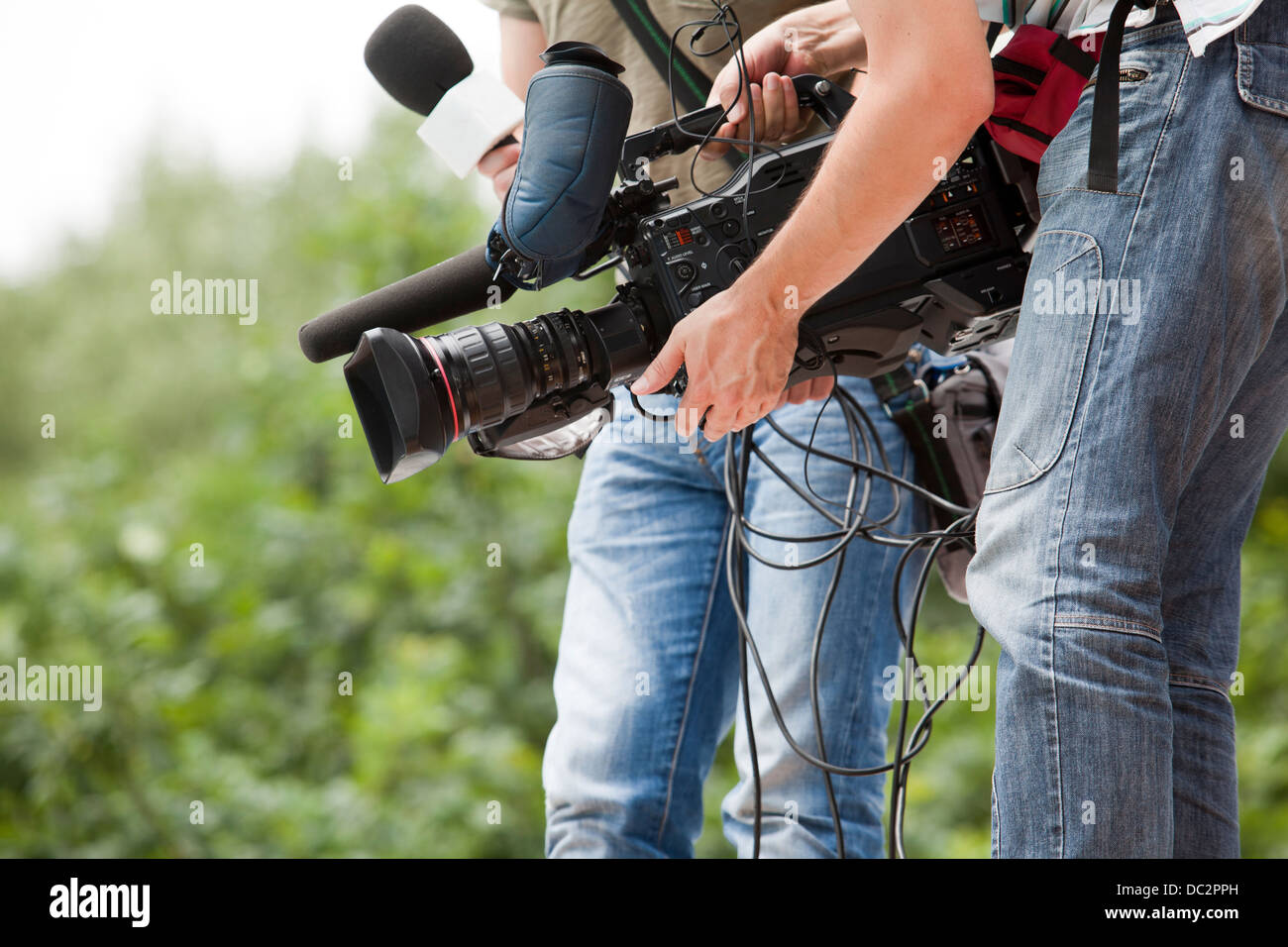 capturing event with professional video camera Stock Photo - Alamy