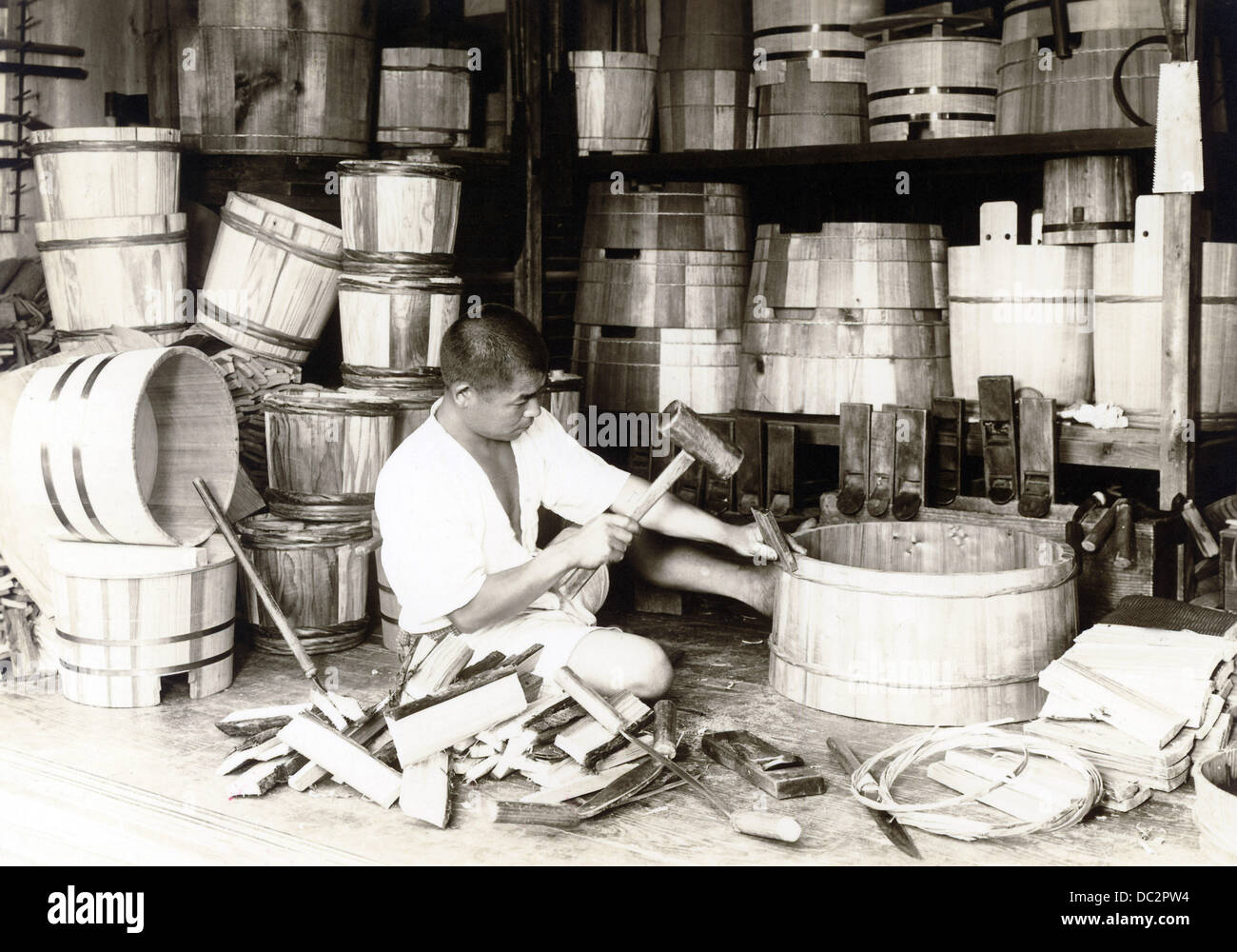 Barrel-maker. Pictured in the early 1920th Stock Photo - Alamy