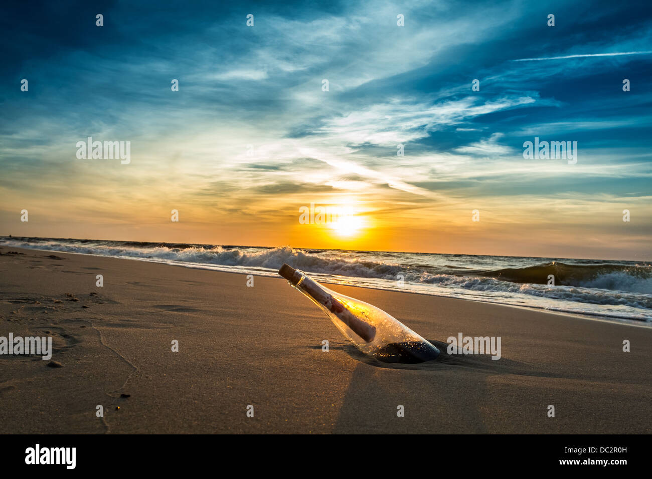 Message in a bottle on the beach Stock Photo - Alamy