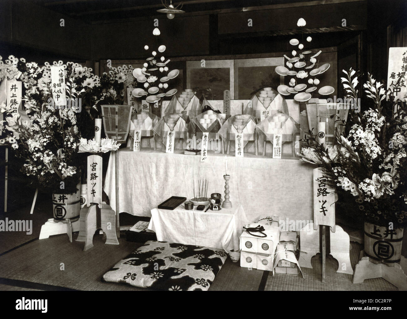 Altar - funeral service. The urn in the center is covered by a white ...
