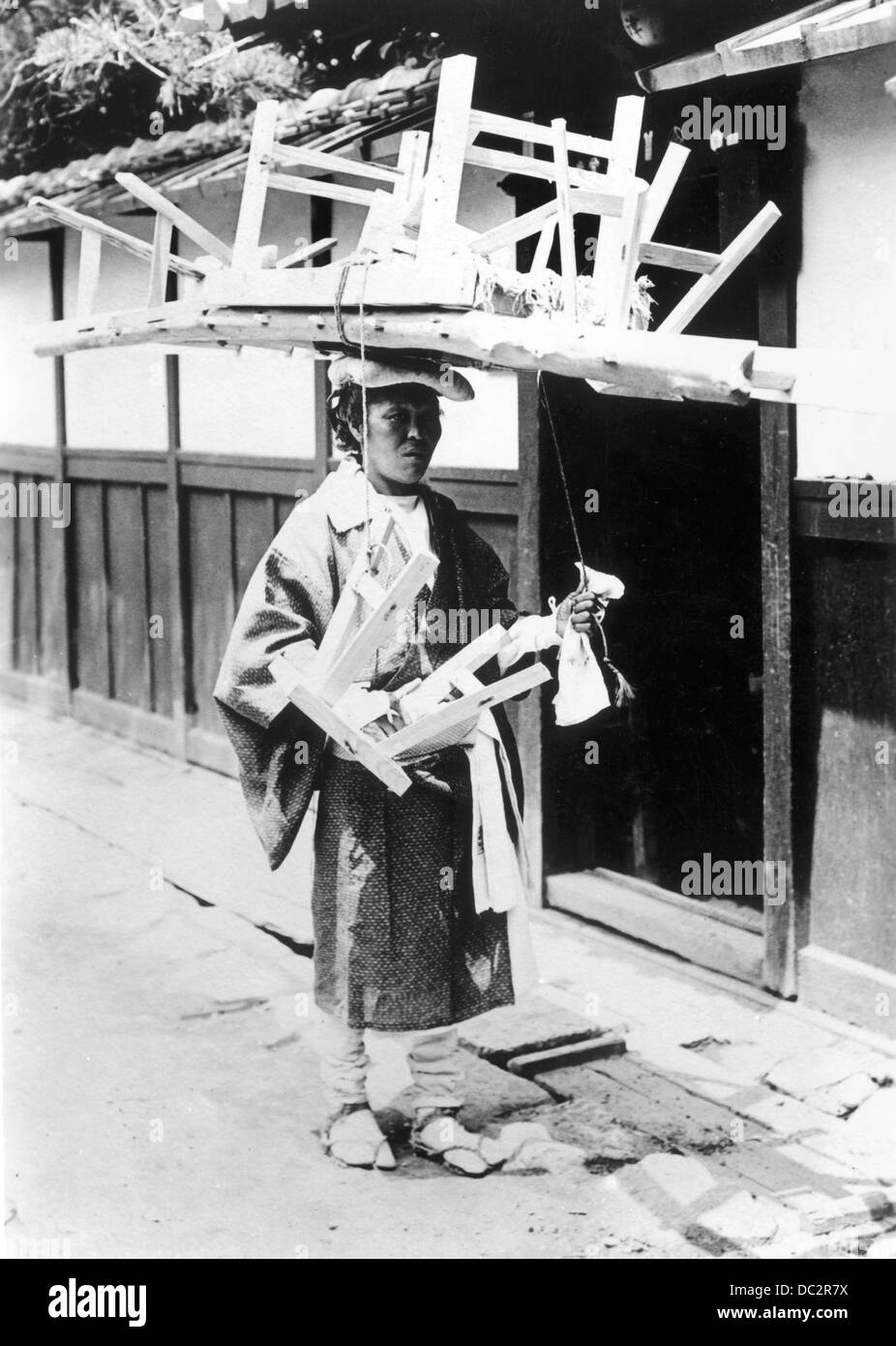 Female pilgrim transporting her bed on the head. Pictured in the early ...