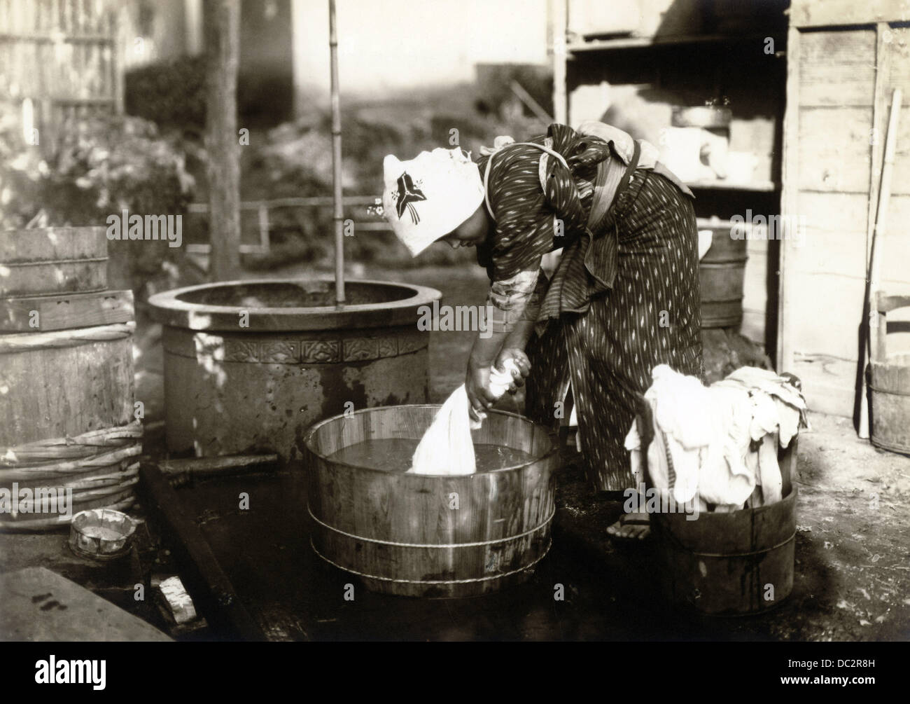 Farmers wife washing cloth in a tub Pictured in the early 1920th Stock ...