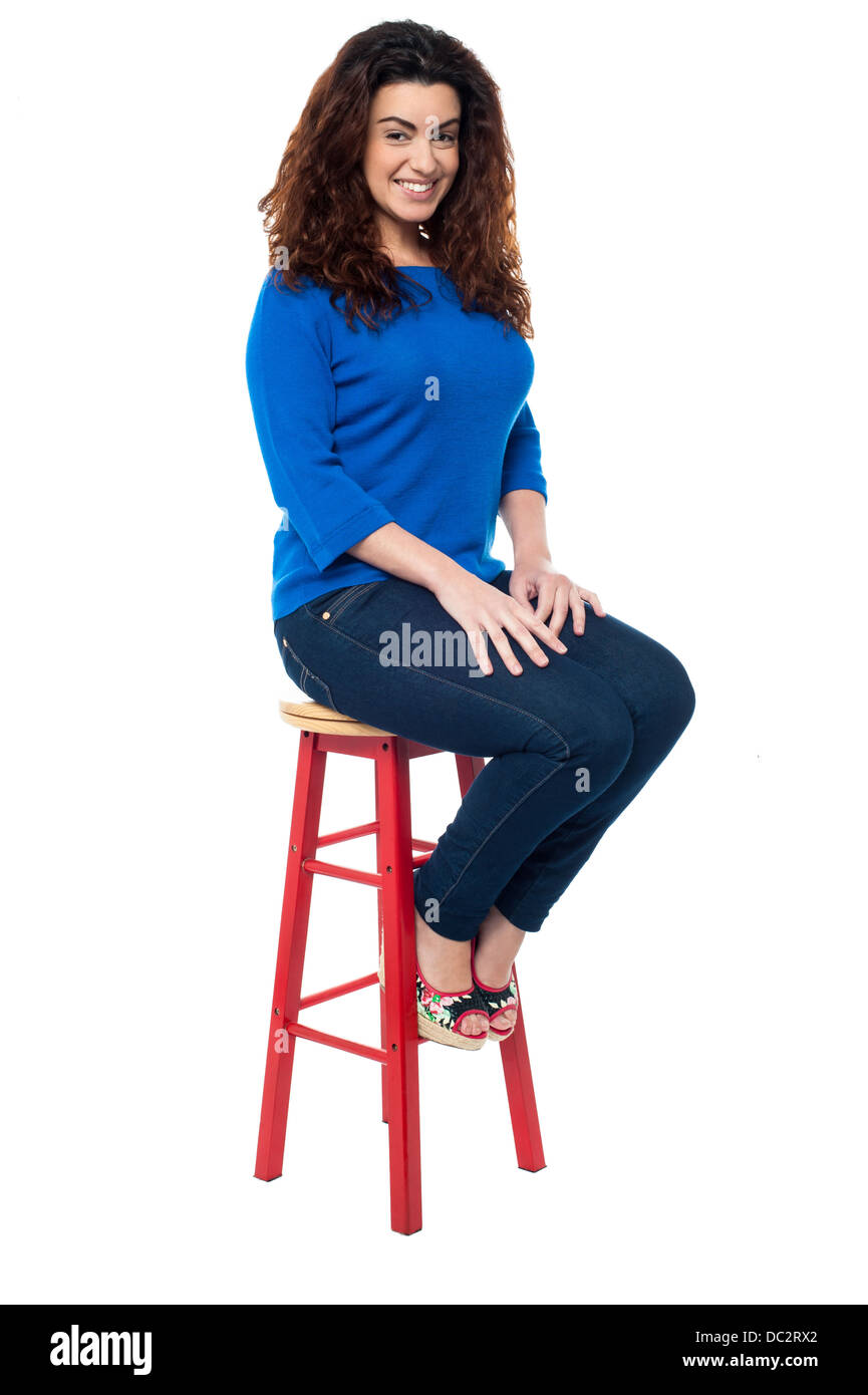 Woman seated on stool hi-res stock photography and images - Alamy