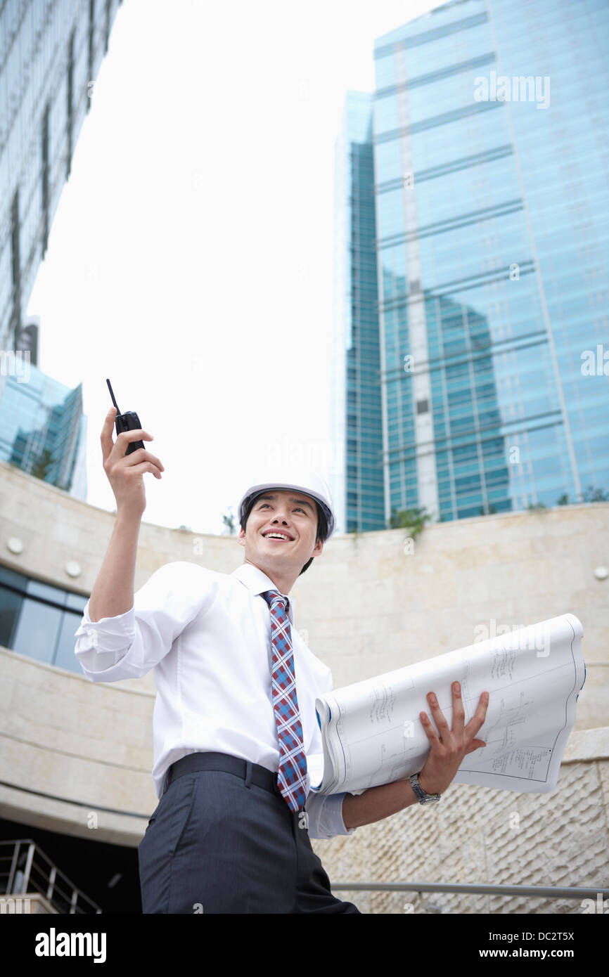 construction working in front of office buildings Stock Photo - Alamy