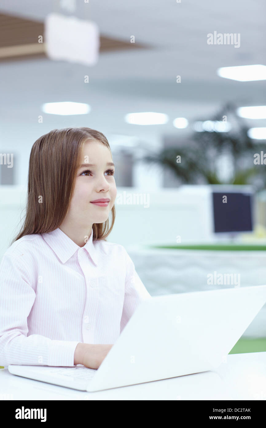 a girl using a laptop Stock Photo - Alamy