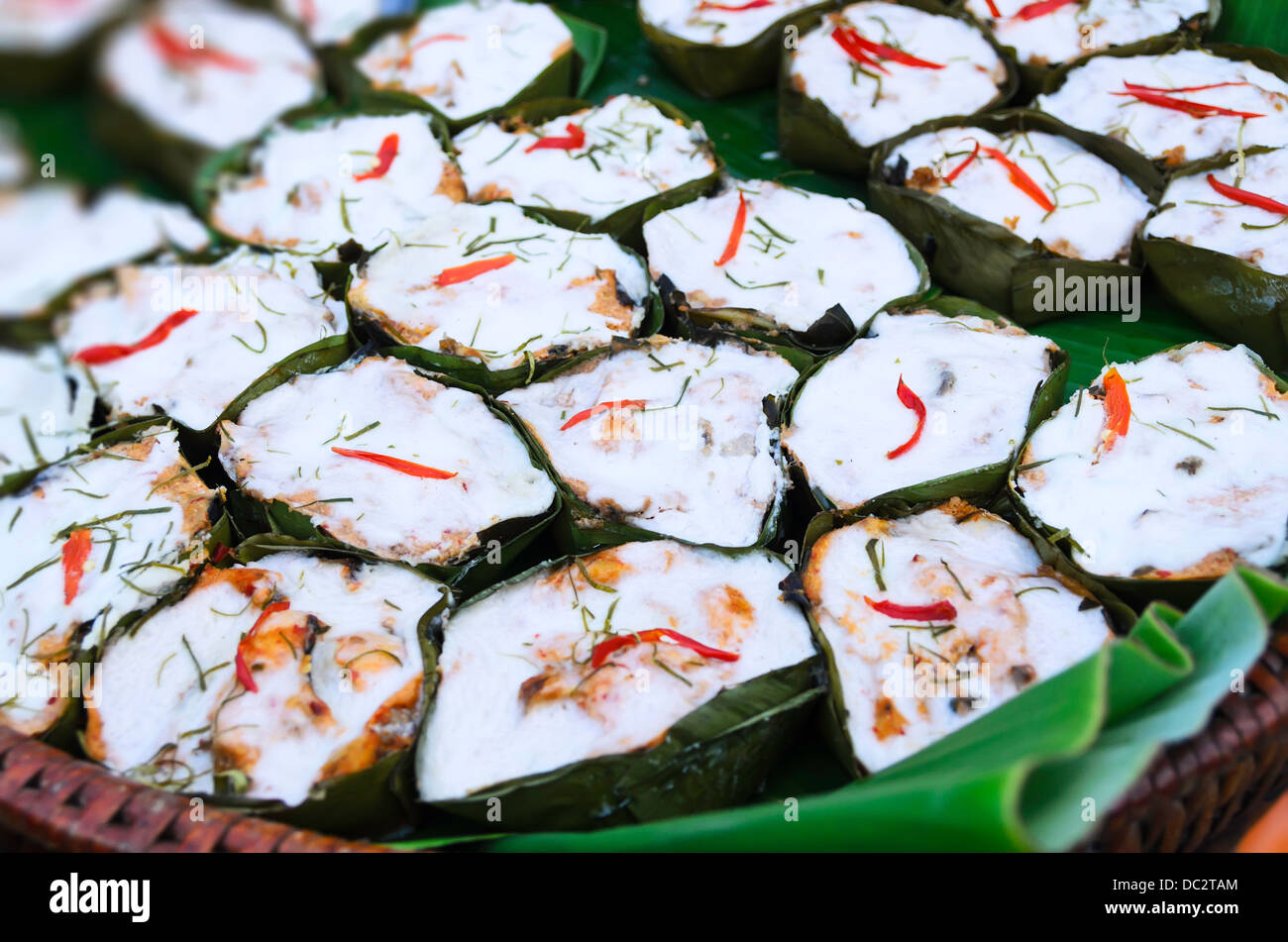 Steamed fish wrapped in basket Stock Photo - Alamy