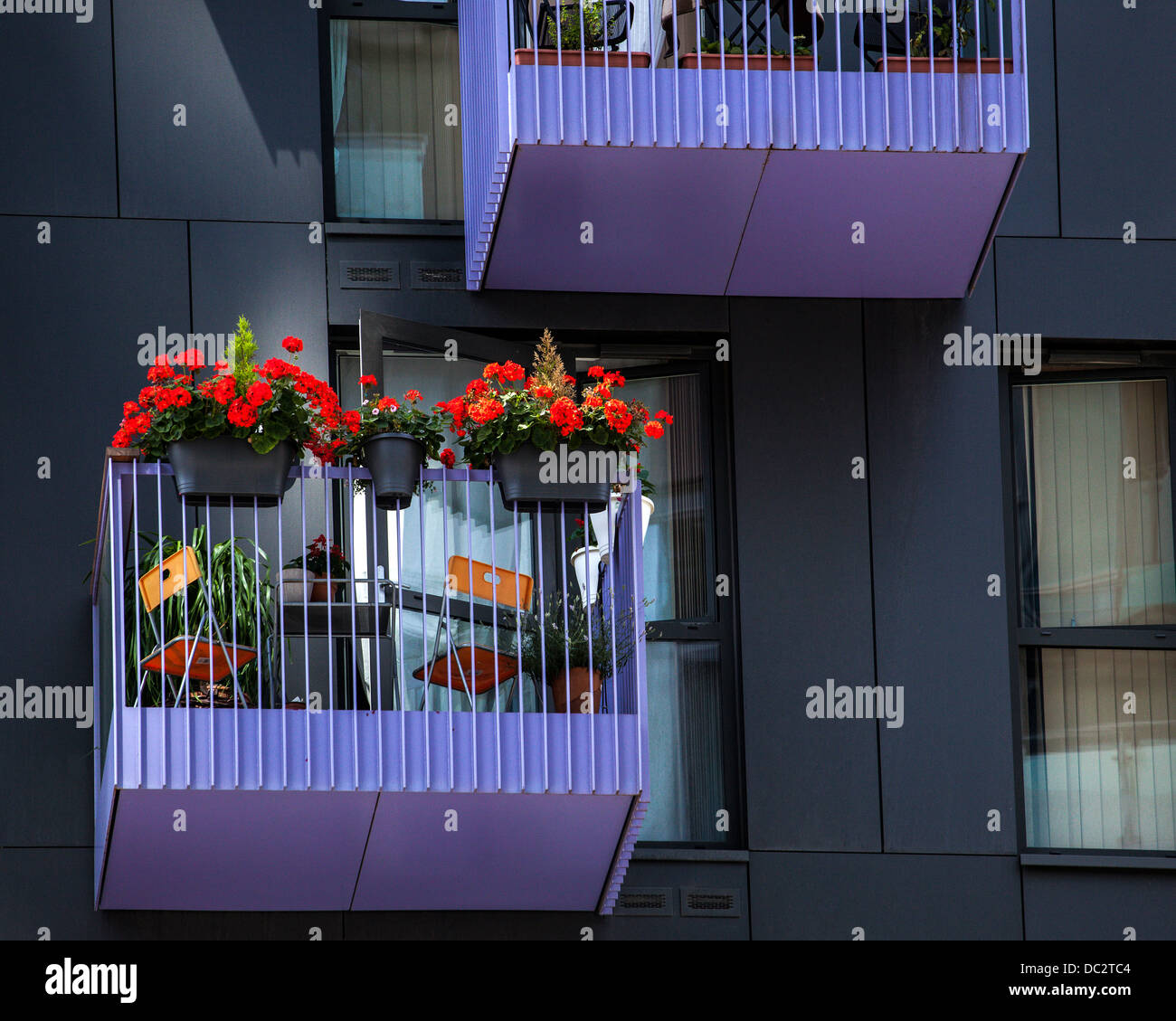 Colourful Apartment Balconies with Brighly Coloured Flowers in Window ...
