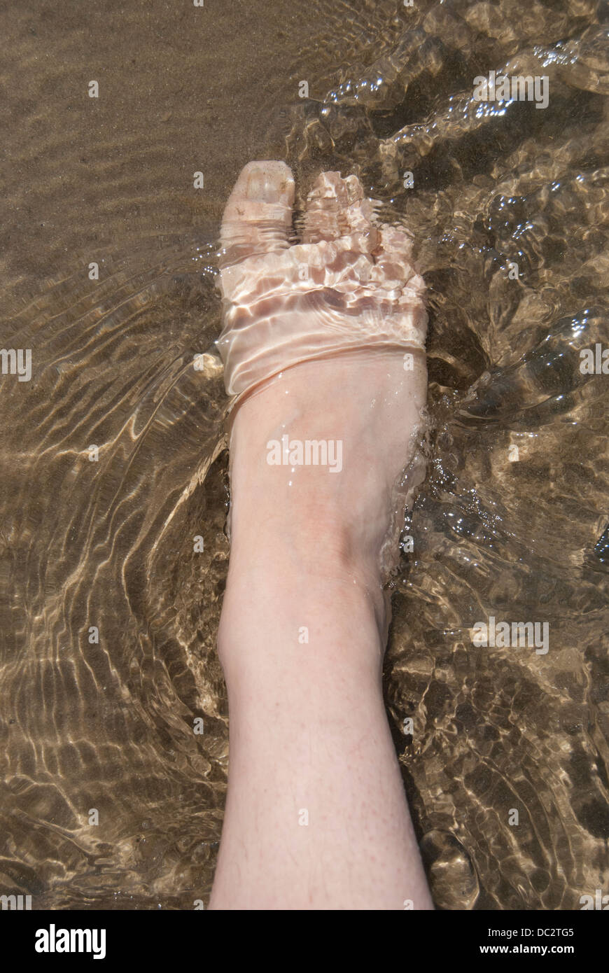 Foot in the sea Stock Photo - Alamy