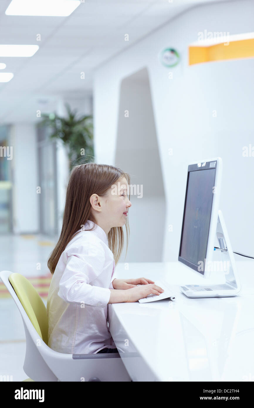 a girl using a PC Stock Photo - Alamy