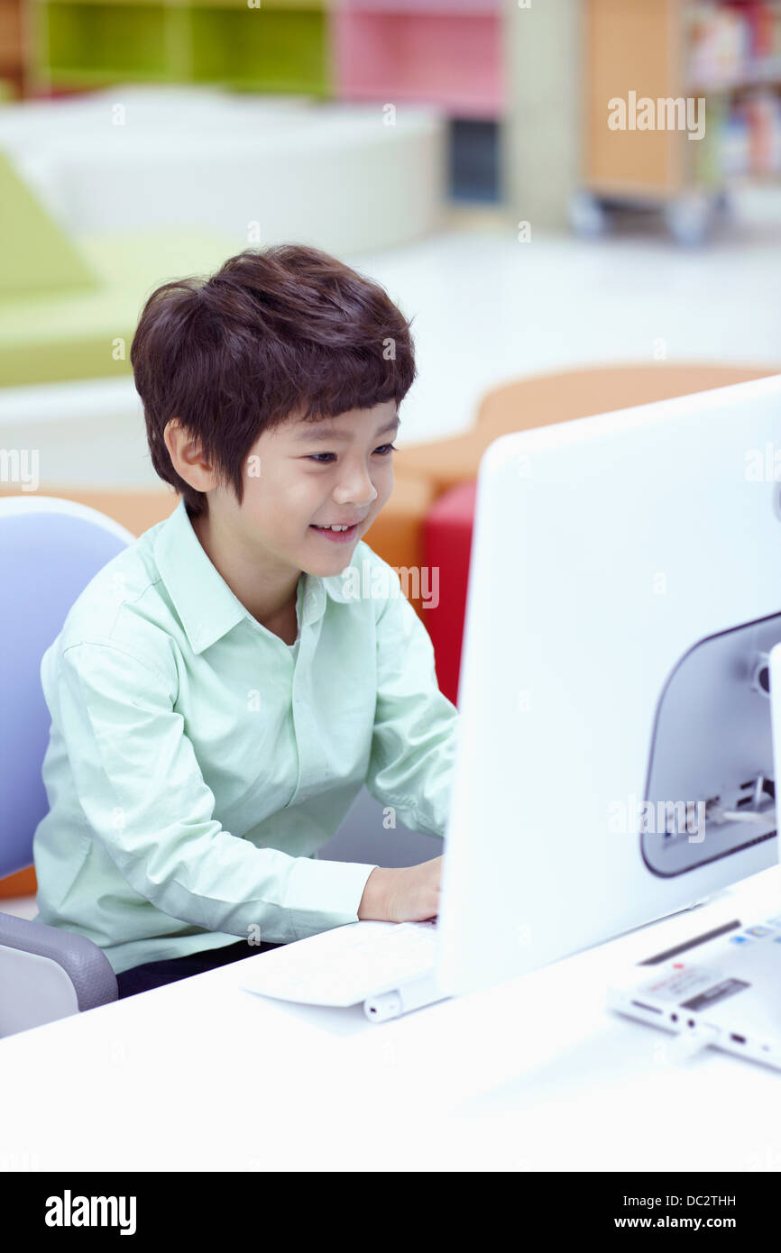 a boy using a PC Stock Photo - Alamy