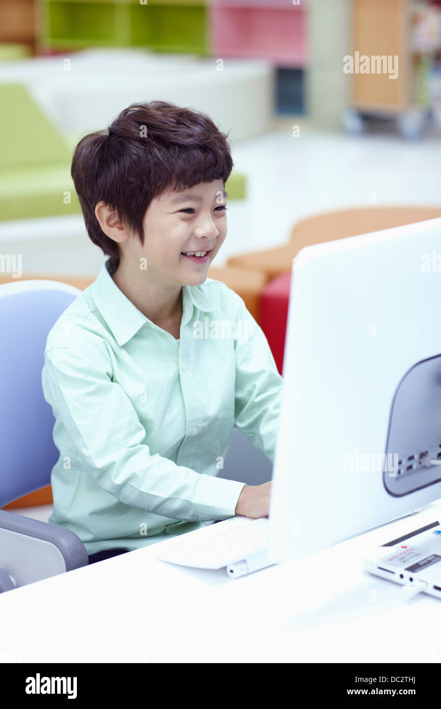a boy using a PC Stock Photo - Alamy