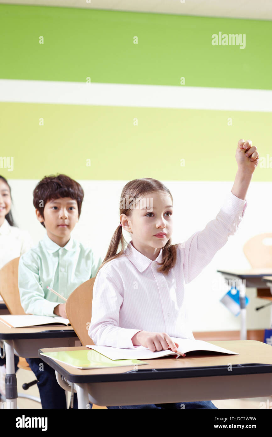 kids in a classroom sitting in a line Stock Photo - Alamy