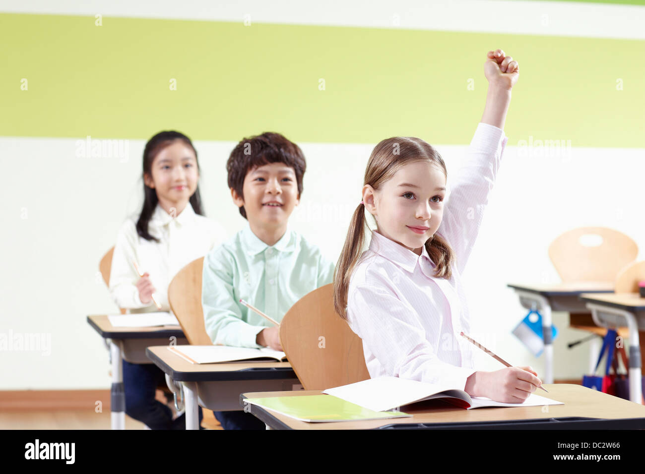 kids in a classroom sitting in a line Stock Photo - Alamy