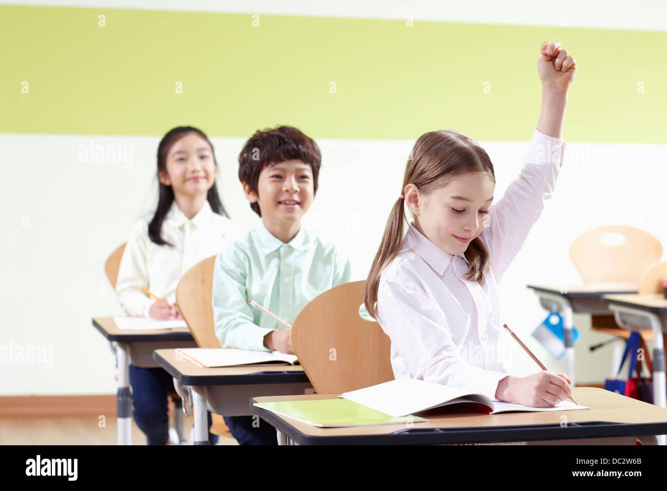 kids in a classroom sitting in a line Stock Photo - Alamy