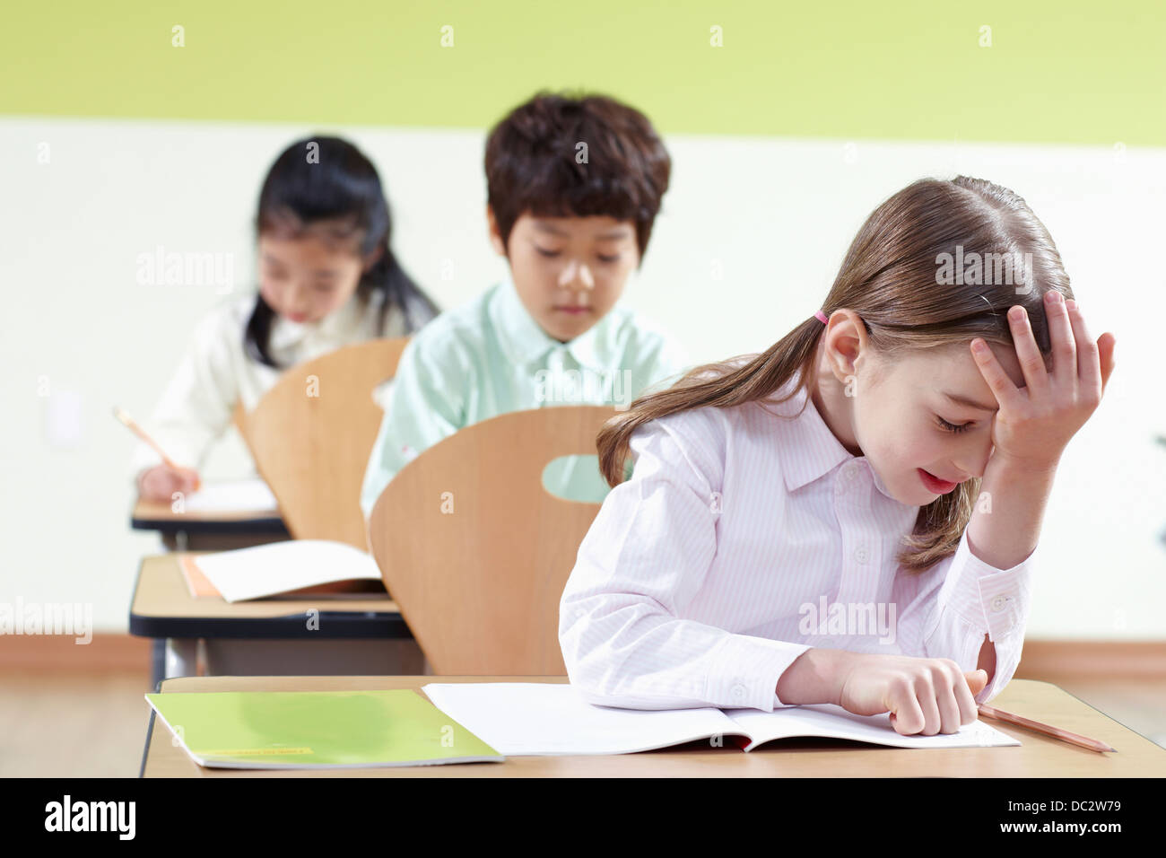 kids in a classroom sitting in a line Stock Photo - Alamy