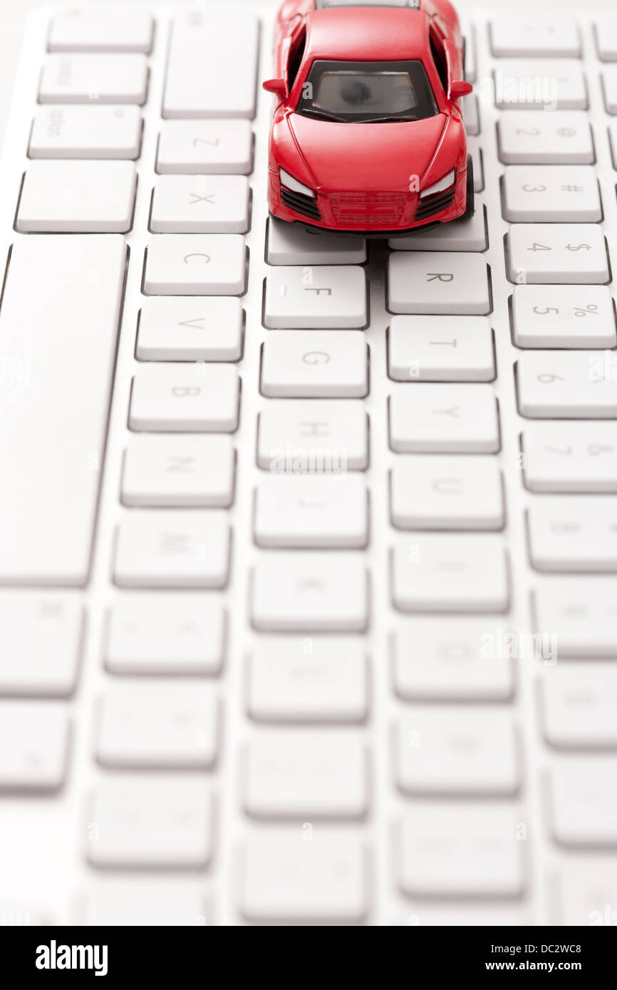 Model car on computer keyboard Stock Photo - Alamy