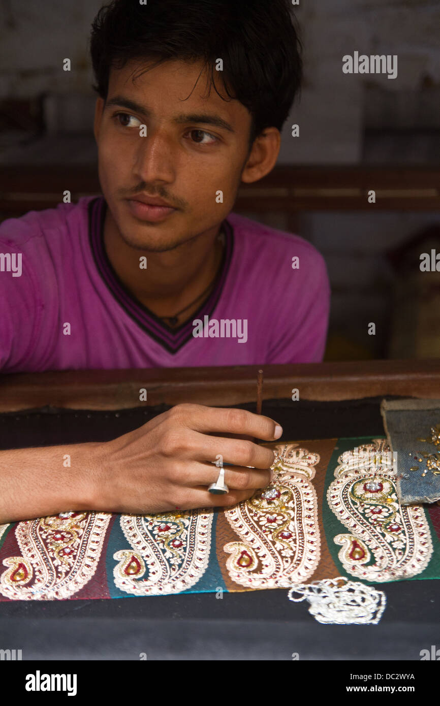 man stiching beads to sari in Varanasi in India Stock Photo - Alamy