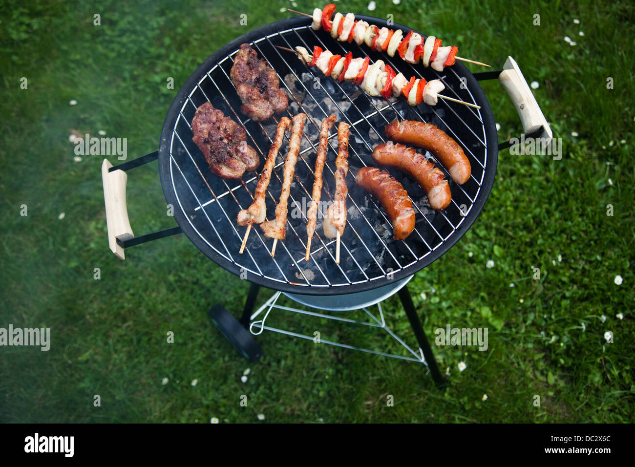 Cooking on the barbecue grill Stock Photo - Alamy