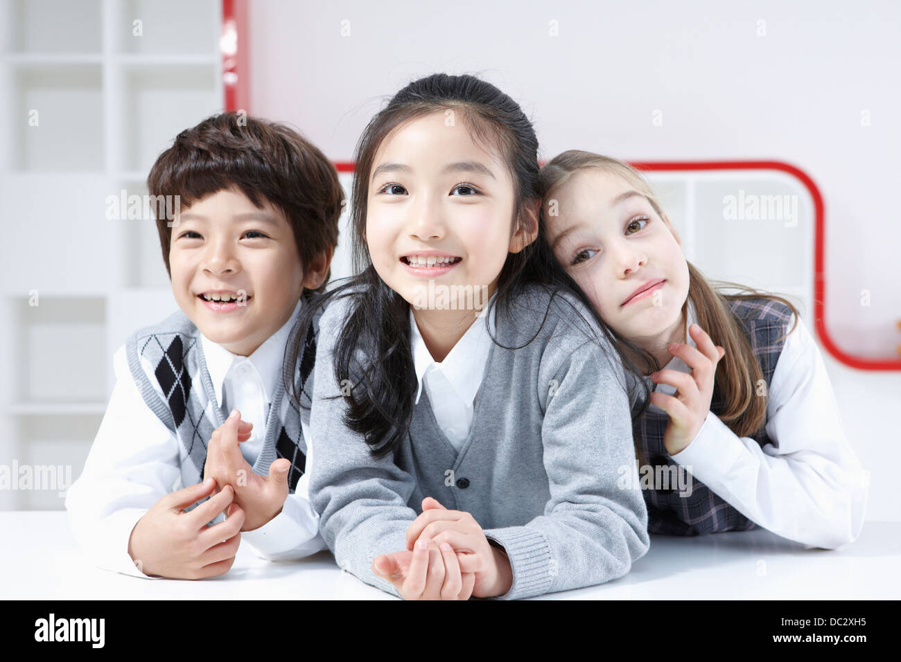 kids smiling in front of camera together Stock Photo - Alamy