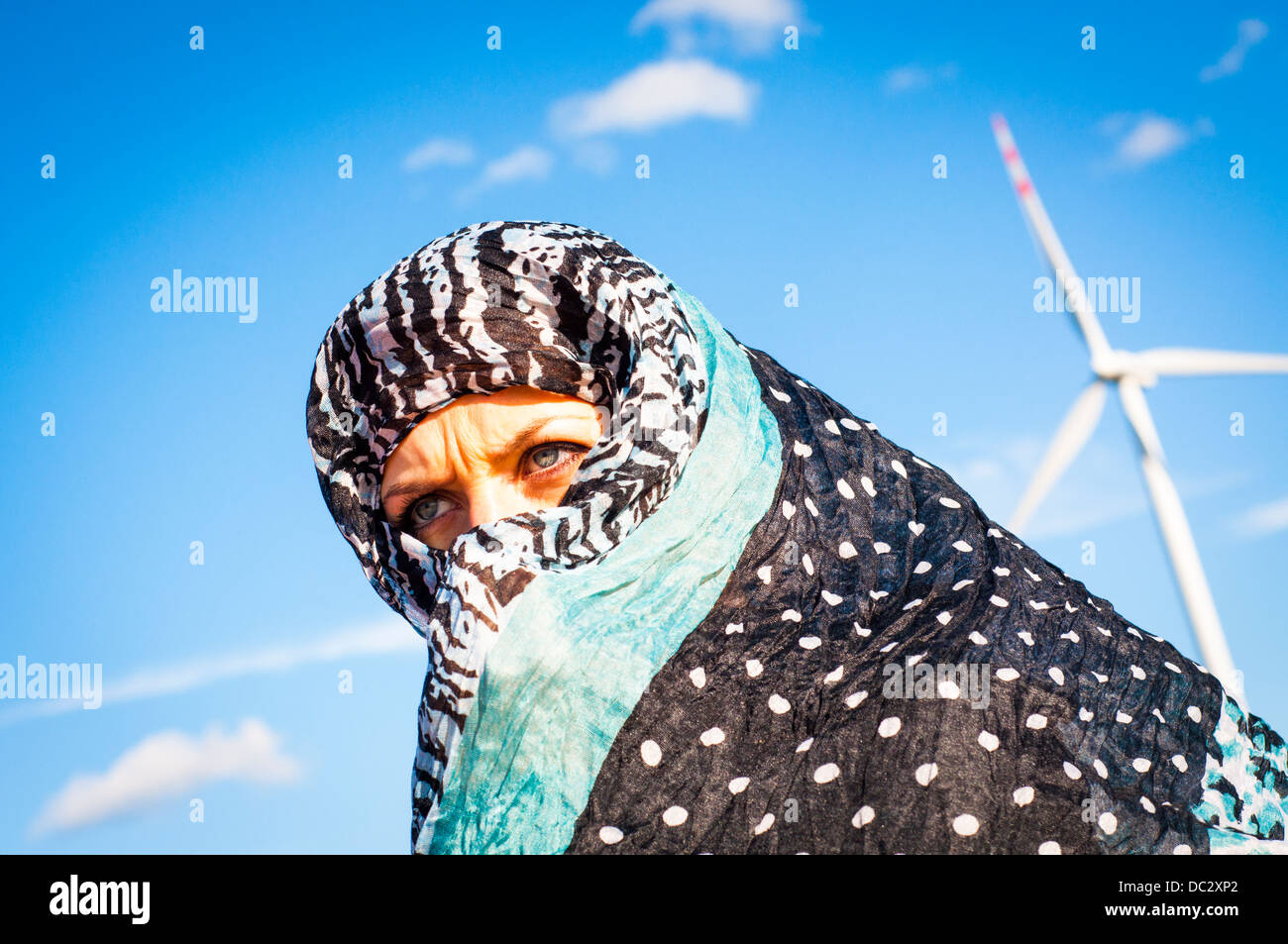 An image of muslim girl and windturbine in the background Stock Photo ...