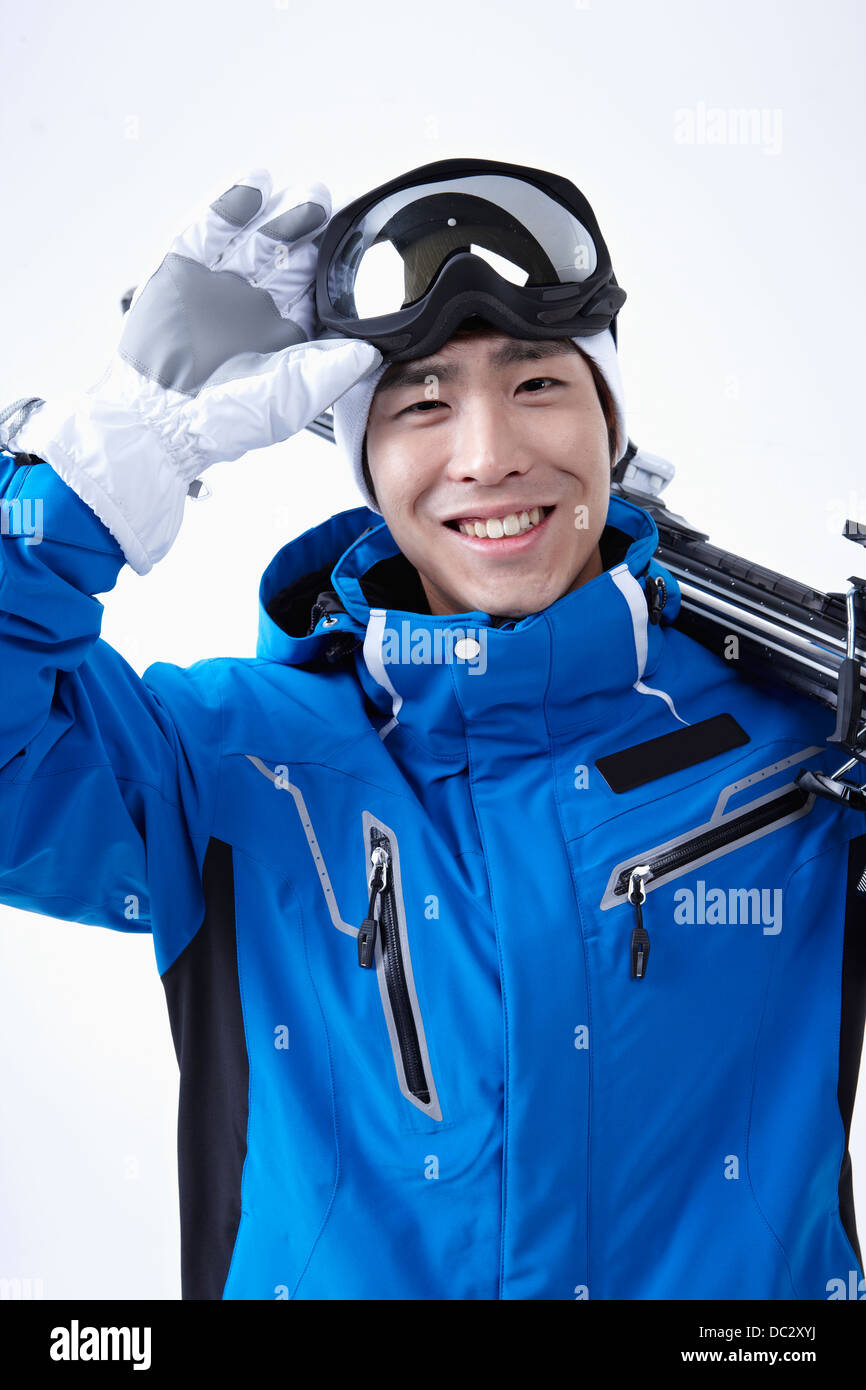 a man in ski outfit posing in white background Stock Photo - Alamy
