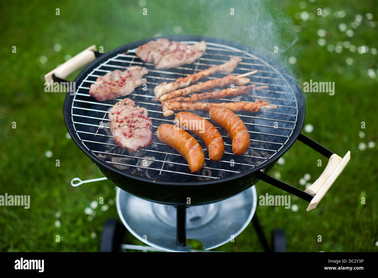 Closeup of meat on grill Stock Photo - Alamy