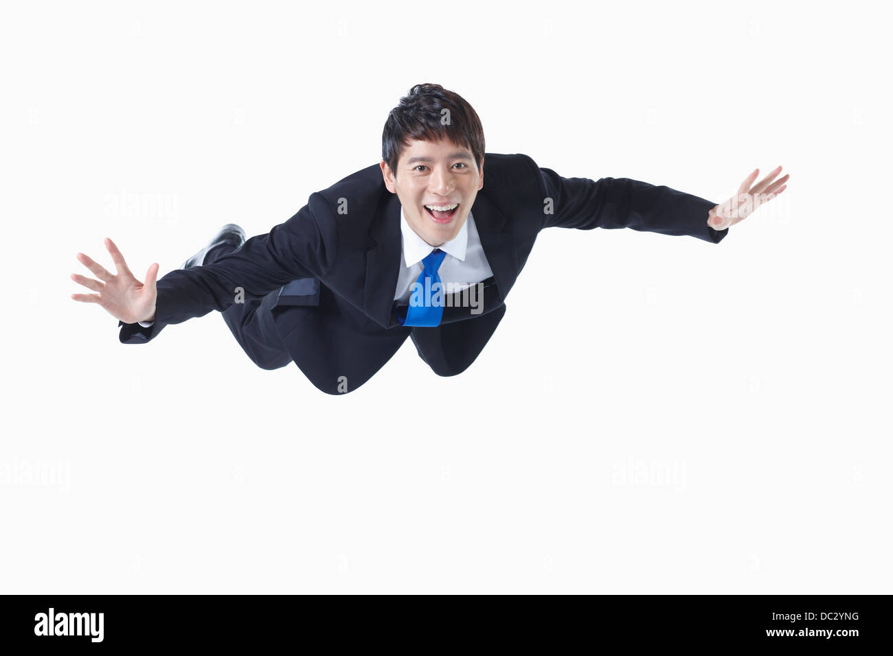 a businessman flying in the air Stock Photo - Alamy